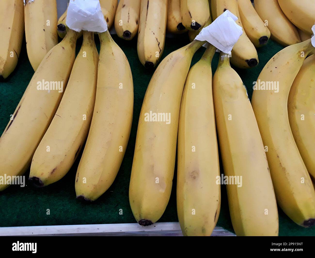 big yellow banana display in store for sale Stock Photo - Alamy