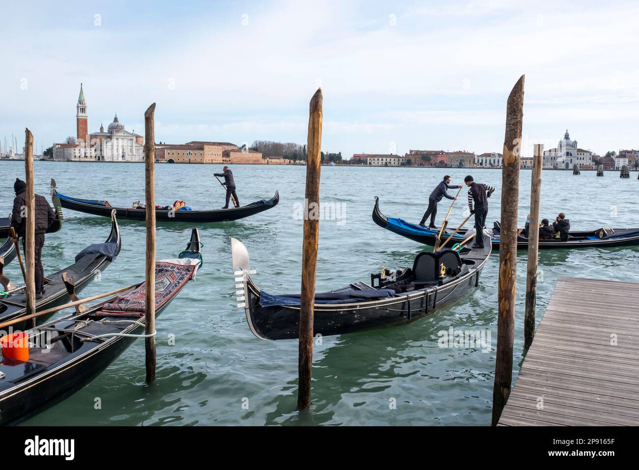 Gondoliers working on the Grand Canal at San Marco, Venice, Italy Stock ...