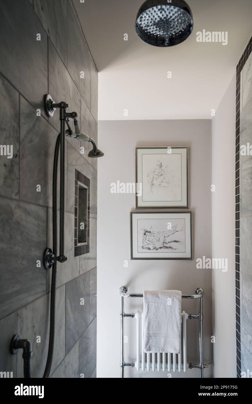 Shower fitting with framed line drawings in tiled wetroom of 16th ...