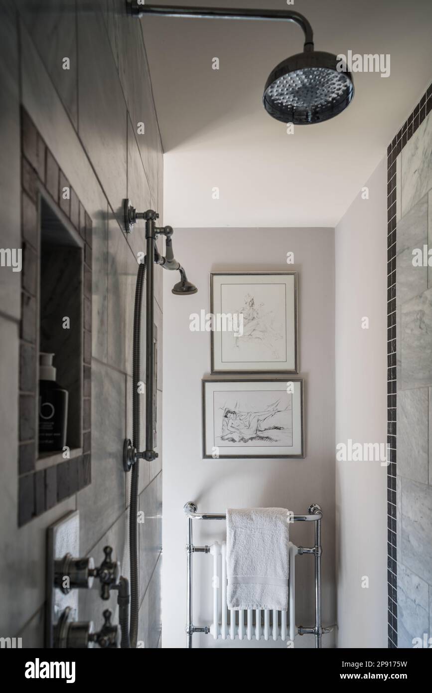 Shower fitting with framed line drawings in tiled wetroom of 16th ...