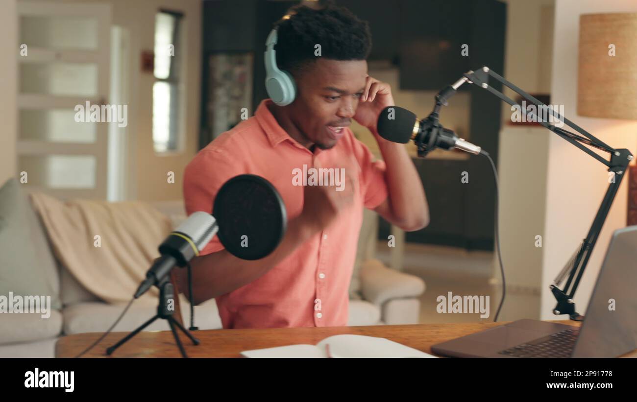 Podcast influencer man with microphone, headphones and home office ...