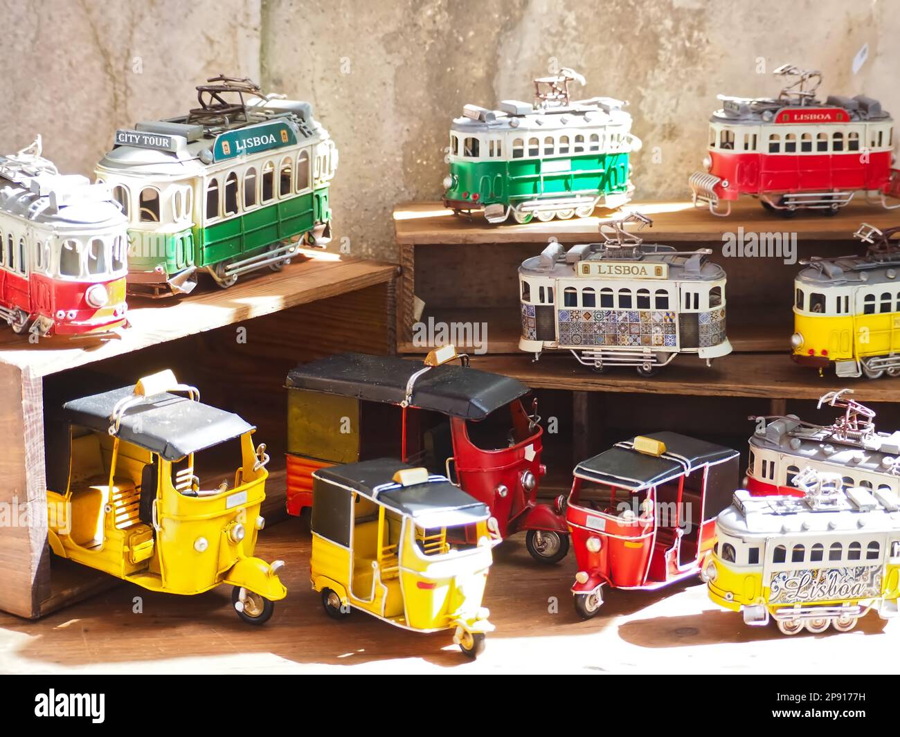 Cute tiny tram souvenirs of Lisbon Stock Photo - Alamy