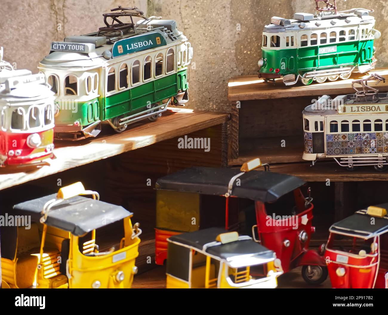 Cute tiny tram souvenirs of Lisbon Stock Photo - Alamy