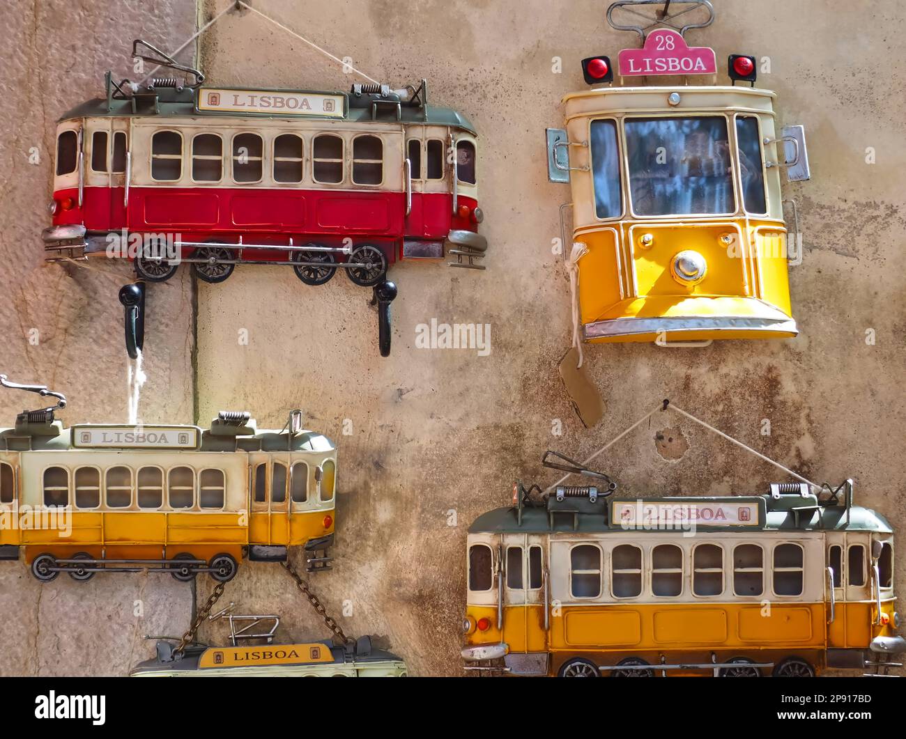 Cute tiny tram souvenirs of Lisbon Stock Photo - Alamy