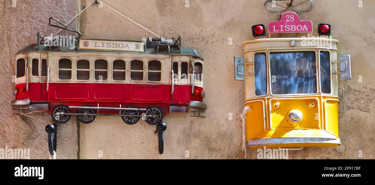 Cute tiny tram souvenirs of Lisbon Stock Photo - Alamy