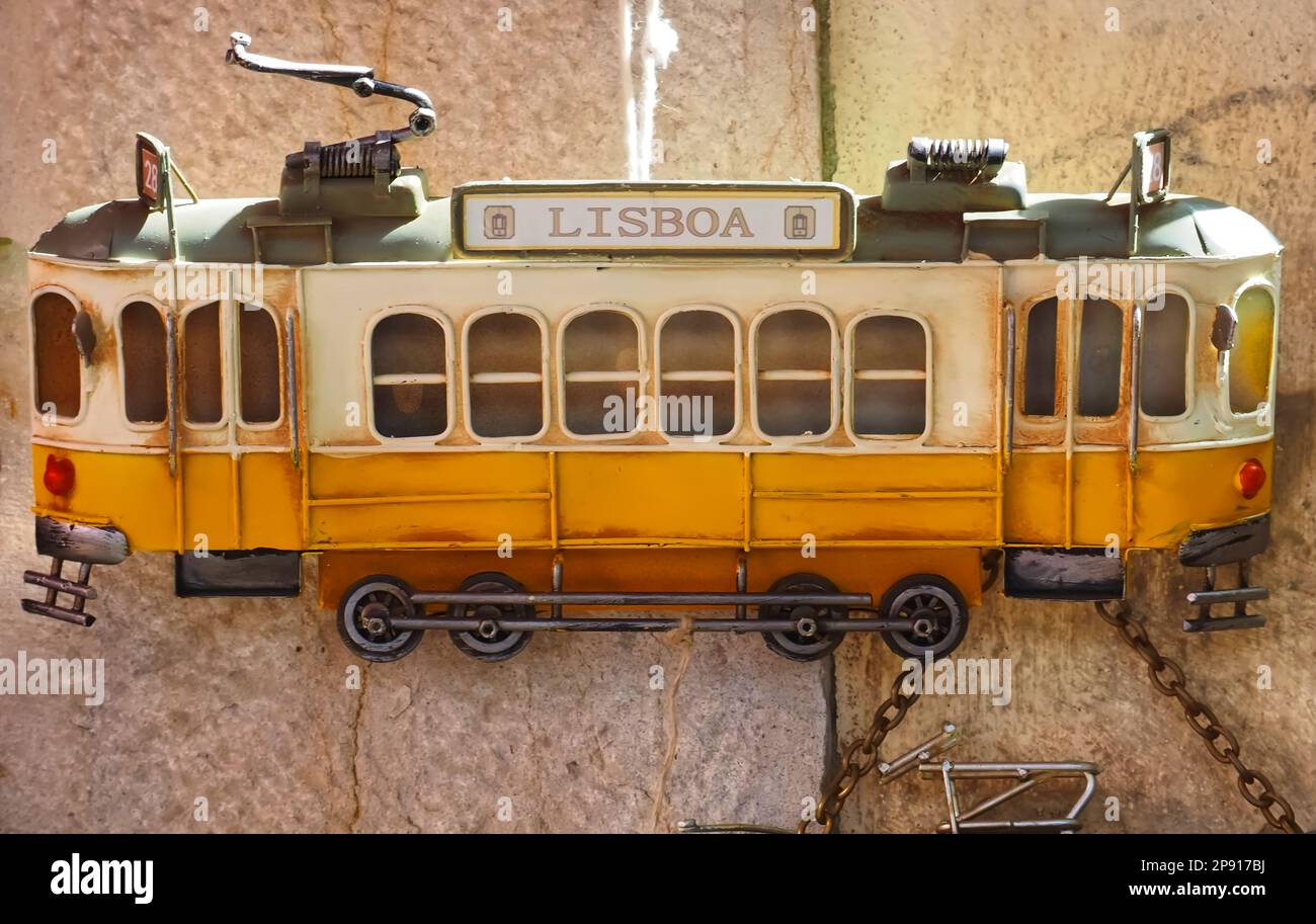 Cute tiny tram souvenirs of Lisbon Stock Photo - Alamy