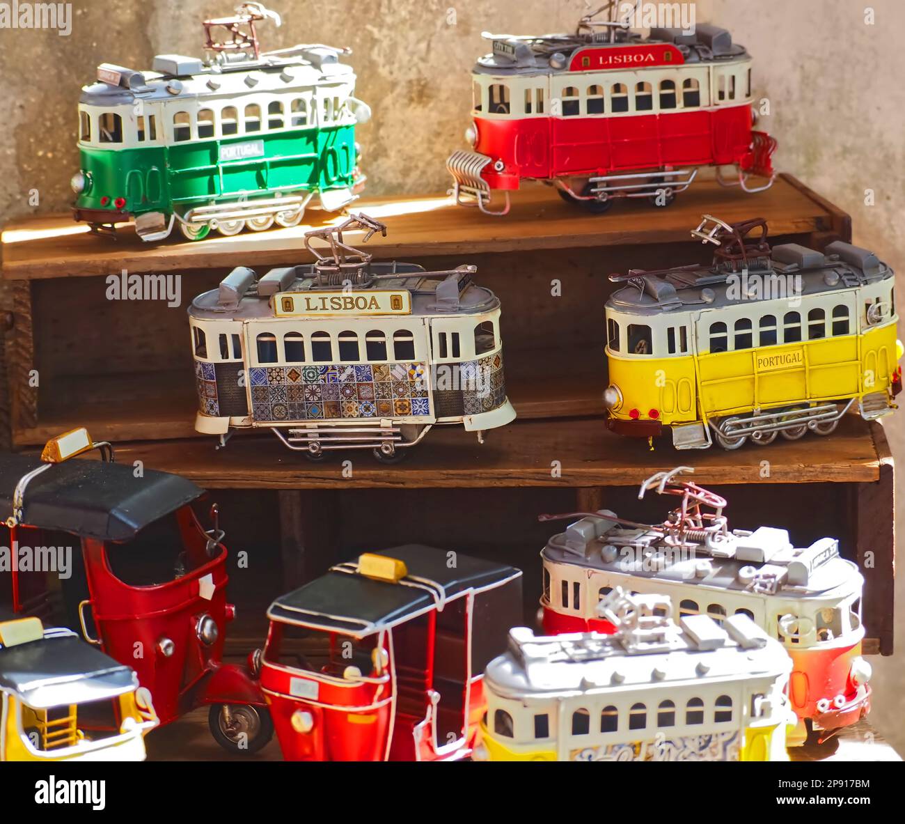 Cute tiny tram souvenirs of Lisbon Stock Photo - Alamy