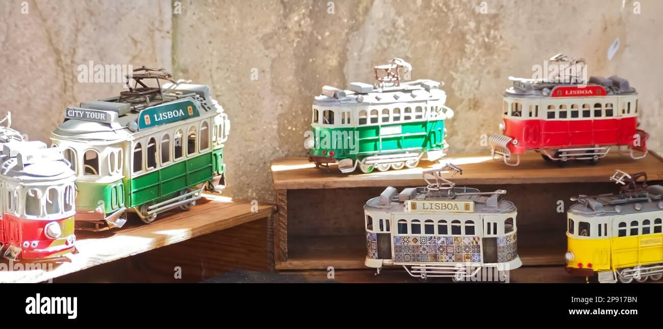 Cute tiny tram souvenirs of Lisbon Stock Photo - Alamy