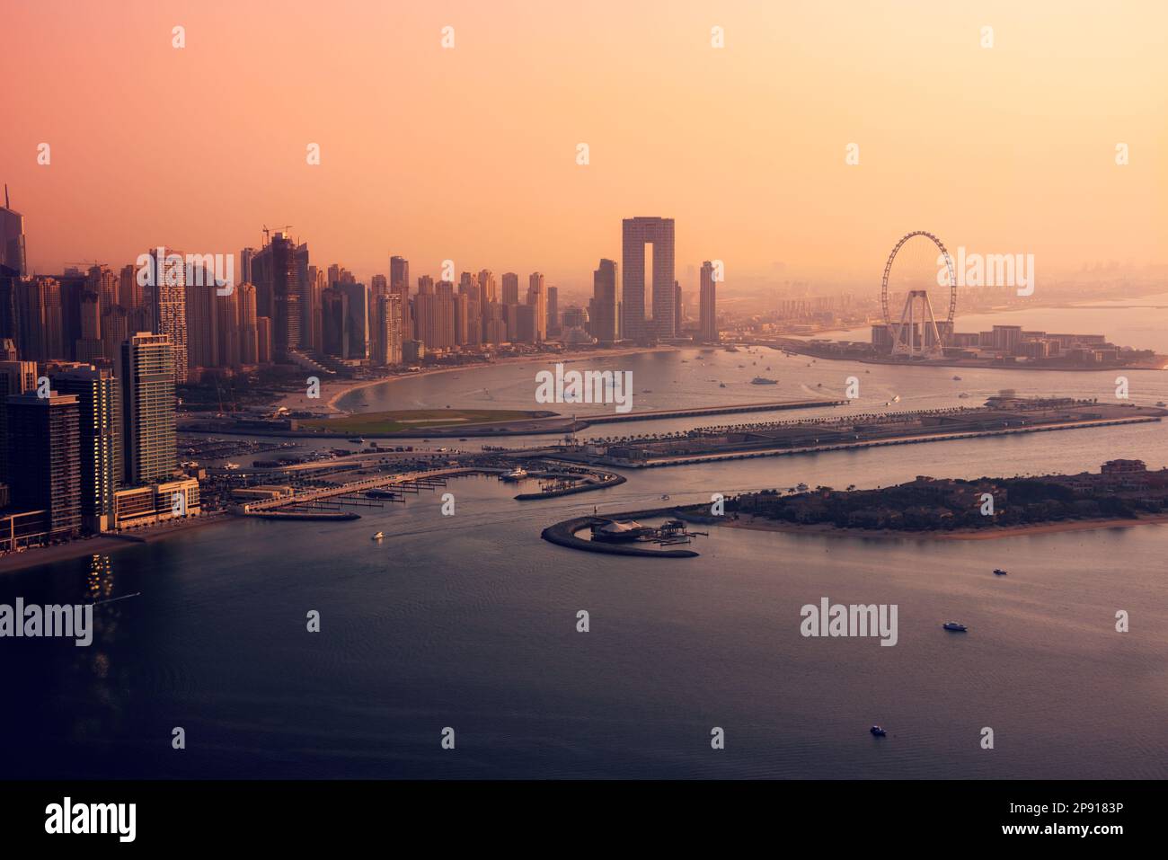 Dubai skyline on sunset, modern city with skyscrapers seen from water ...