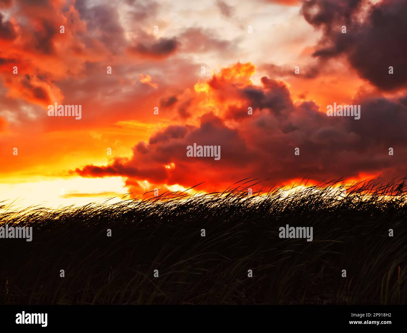 Shift of wind, ragged clouds. Sunset sky colors Stock Photo - Alamy