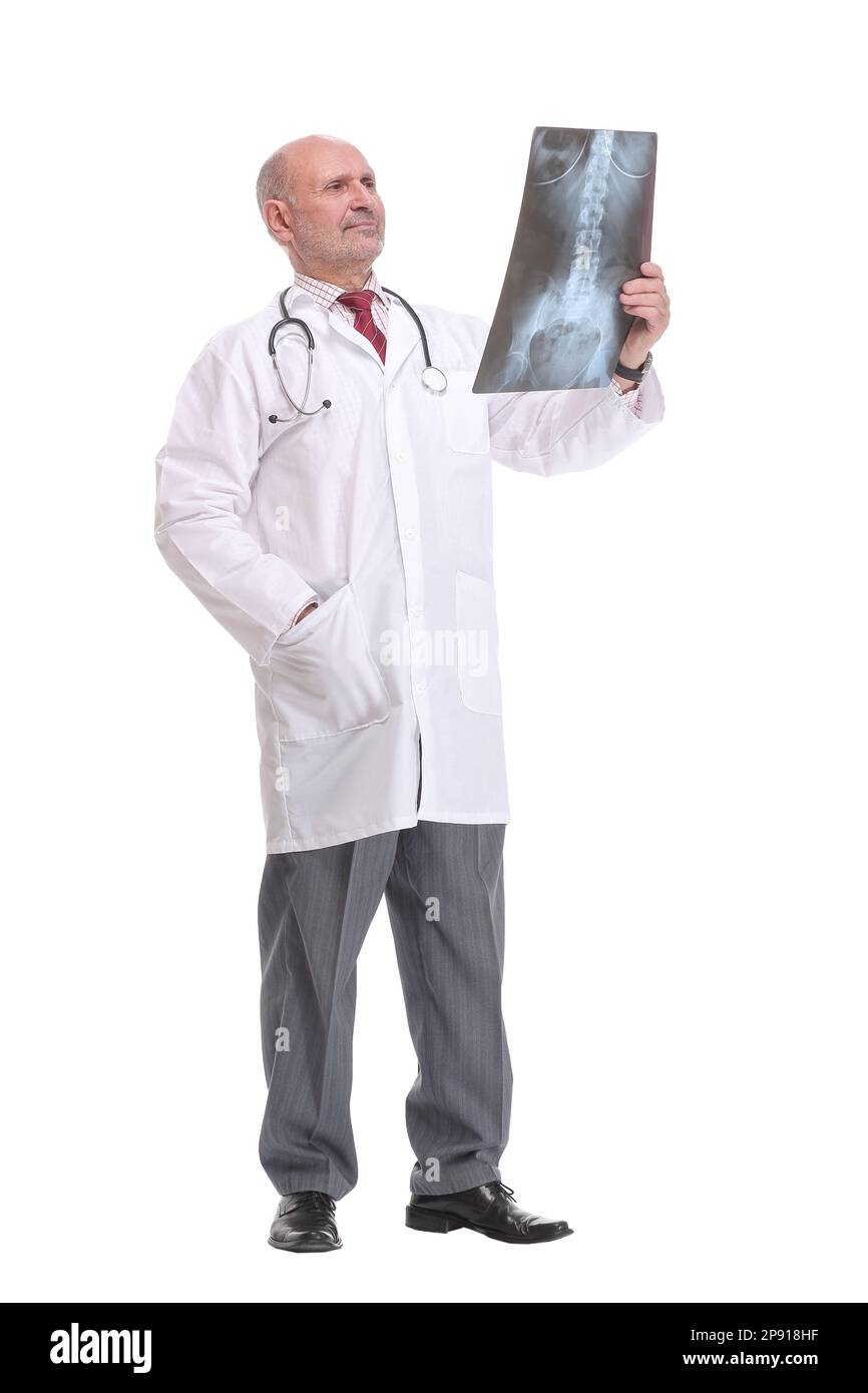 Front view of a senior doctor with stethoscope studying x-ray image ...