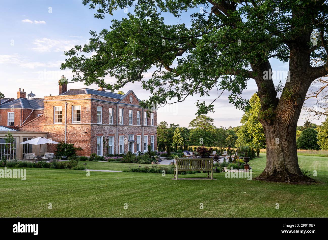 Brick facade and terrace of 18th century Grade II listed Suffolk ...