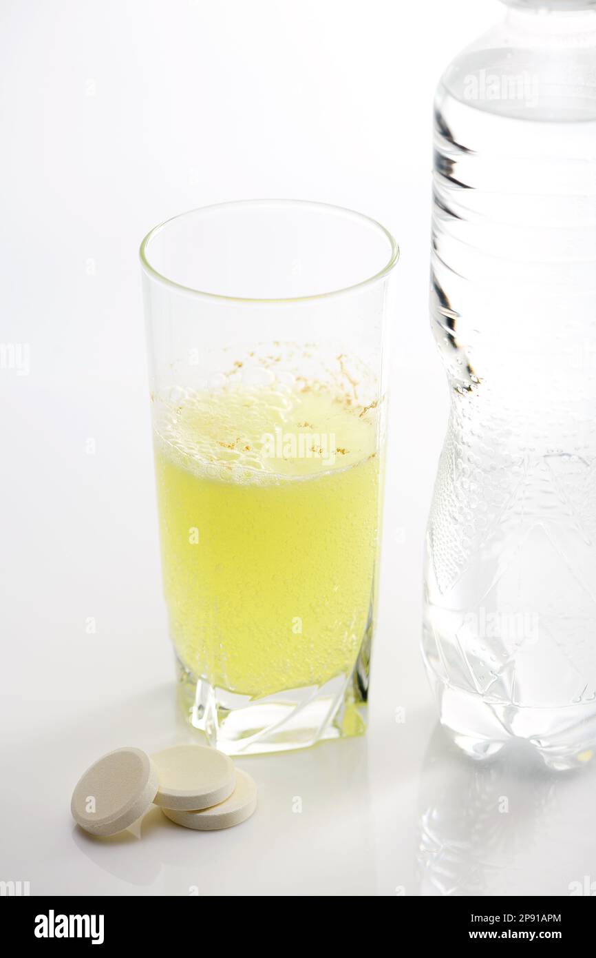 The effervescent tablet dissolves in a glass of water. Close-up Stock ...