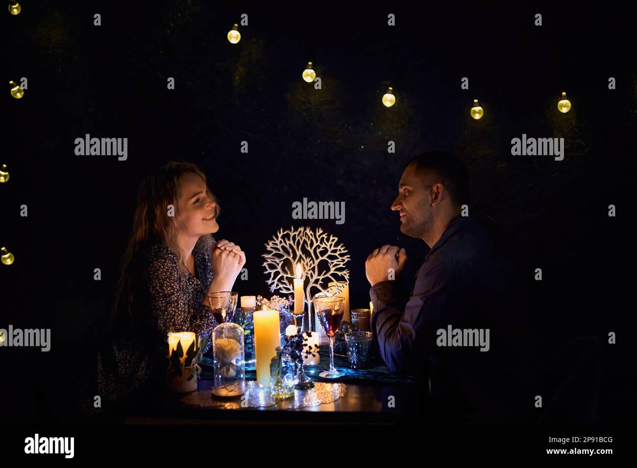 Romantic dinner young couple celebrate hi-res stock photography and ...