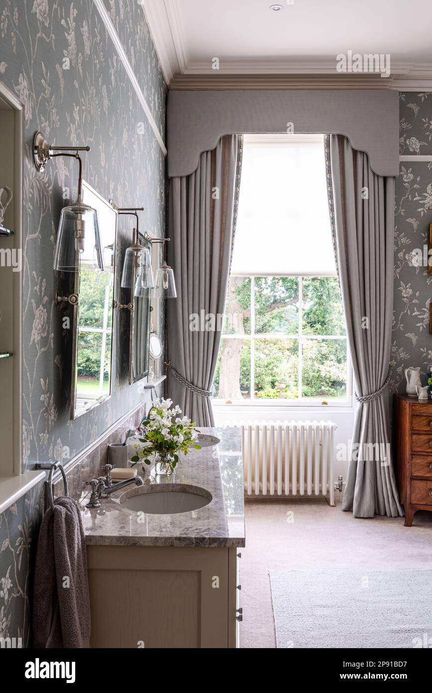 Double basin and window with Colefax and Fowler wallpaper in renovated ...