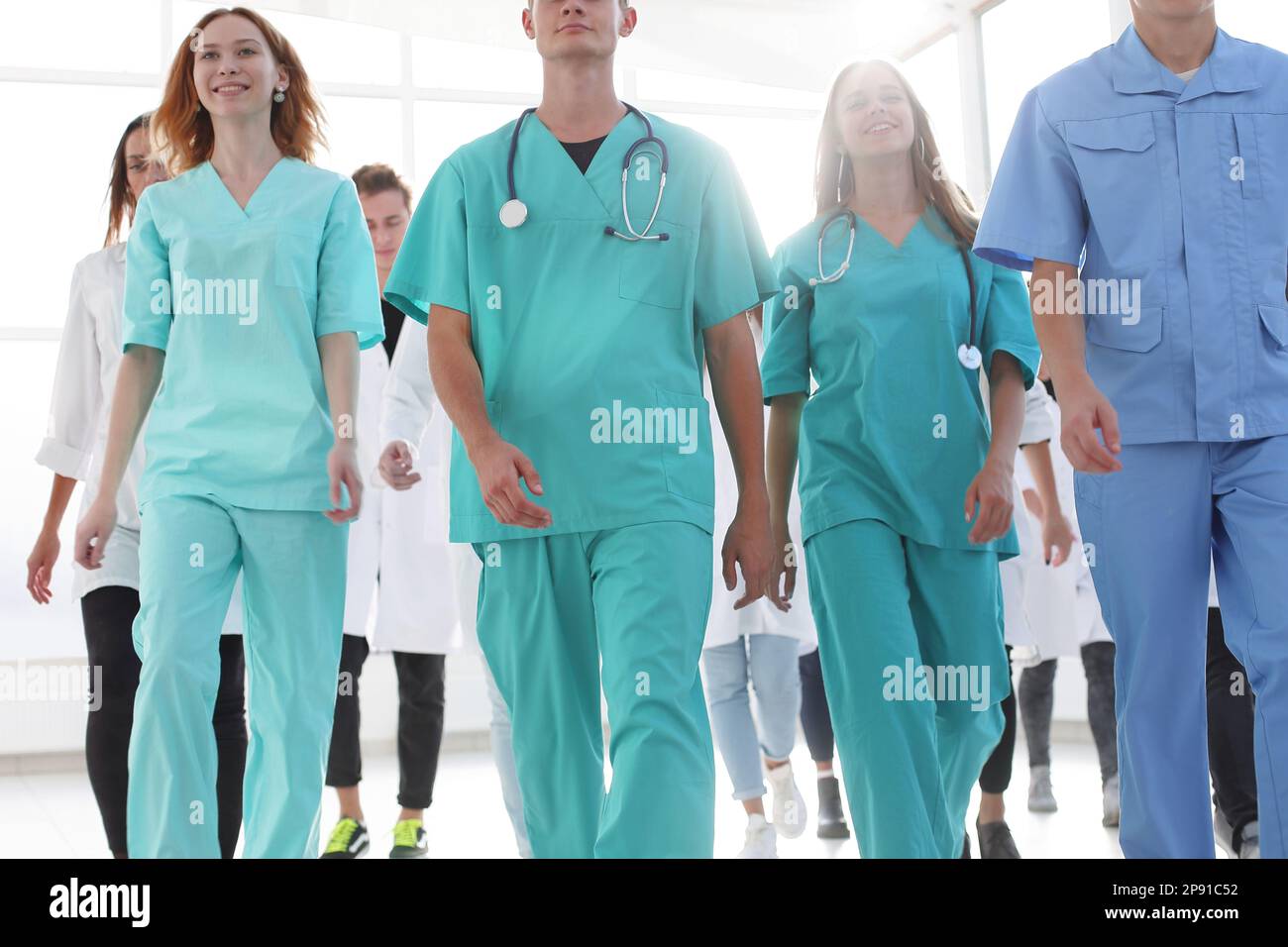 group of happy young medical professionals showing their success Stock ...
