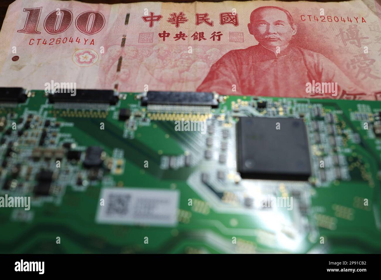 Taiwanese currency and semiconductor printed circuit boards Stock Photo ...