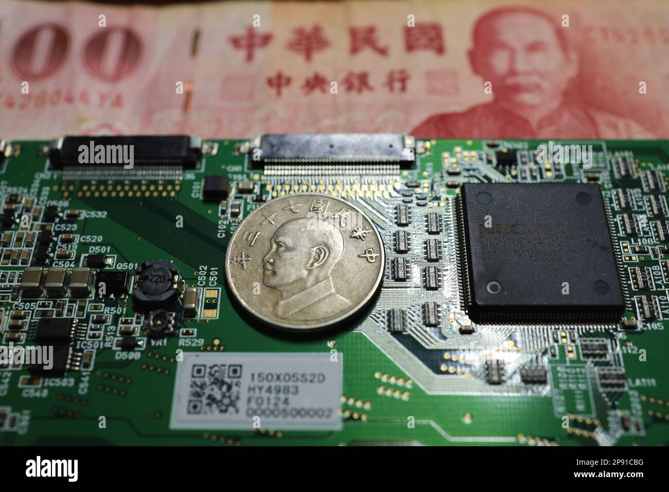 Taiwanese currency and semiconductor printed circuit boards Stock Photo ...
