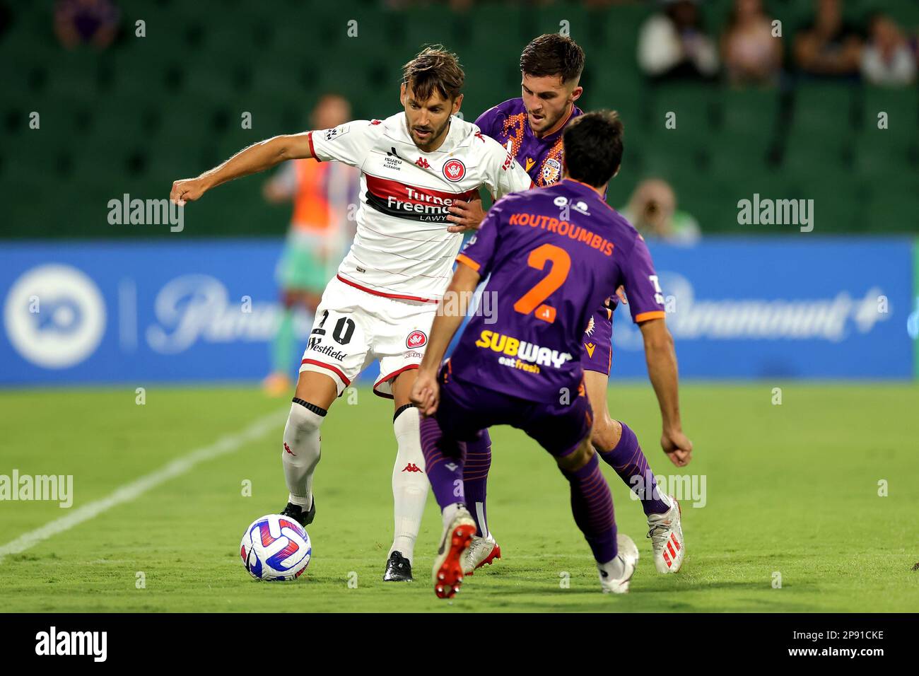 Miloš Ninkovic of the Wanderers is tackled by Luke Bodnar of the Glory ...