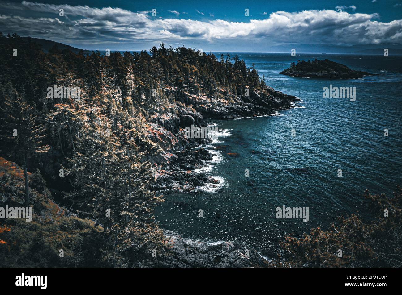 An aerial view of a stunning landscape featuring a rocky cliff ...