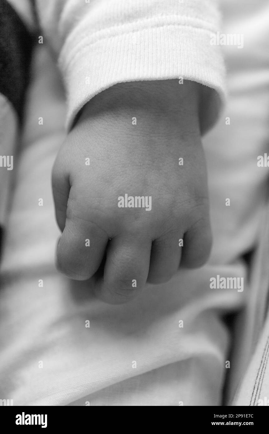 black and white image of detail of baby hand fist Stock Photo - Alamy