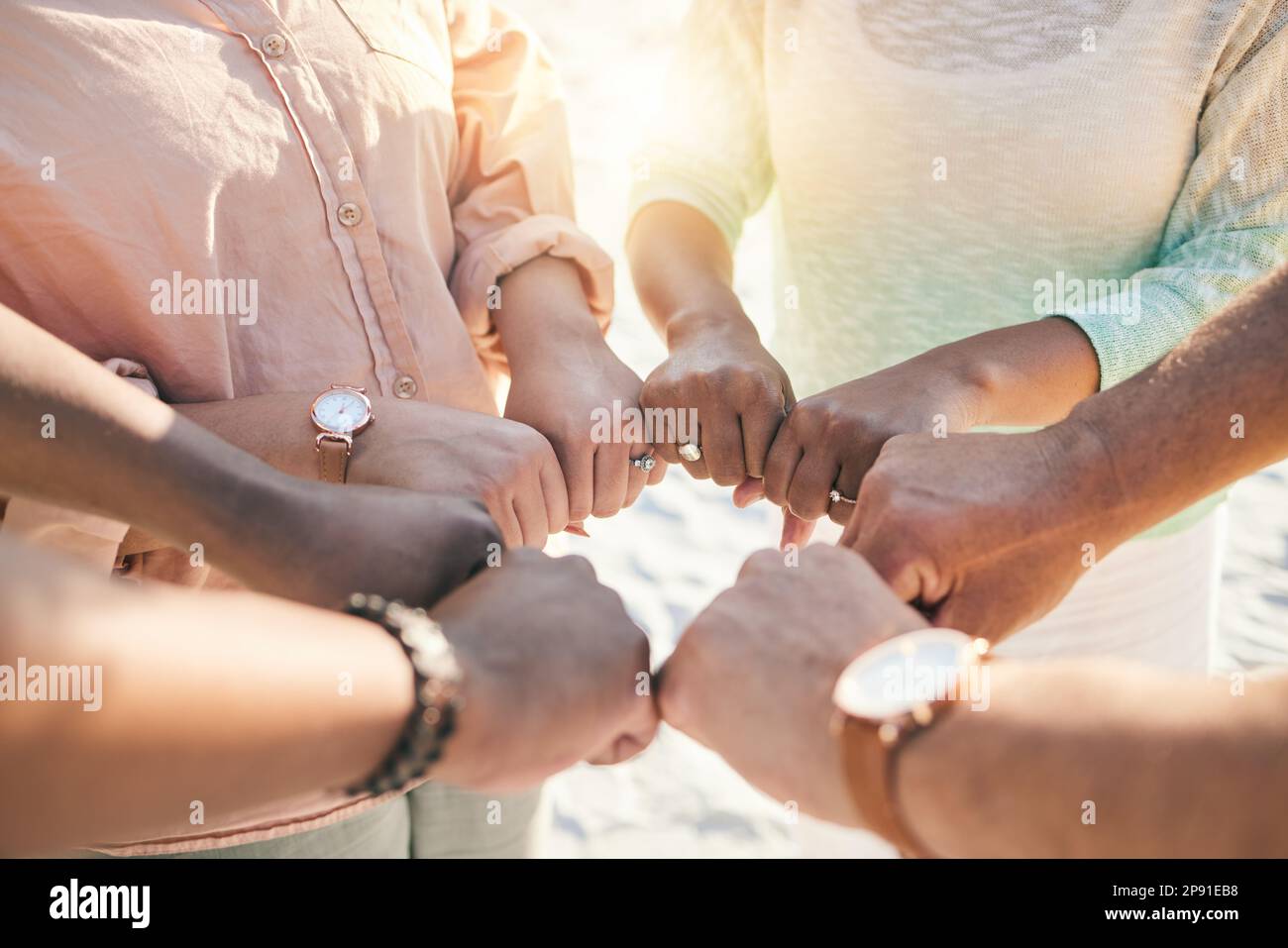 Group of people fist bump together for teamwork, community support and ...