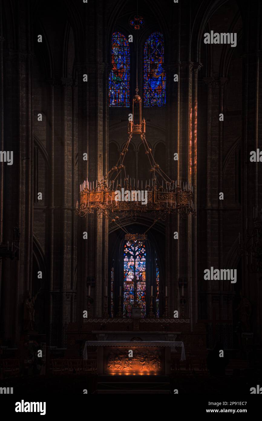 An elegant and ornate place of worship featuring beautiful stained glass windows and a golden ...