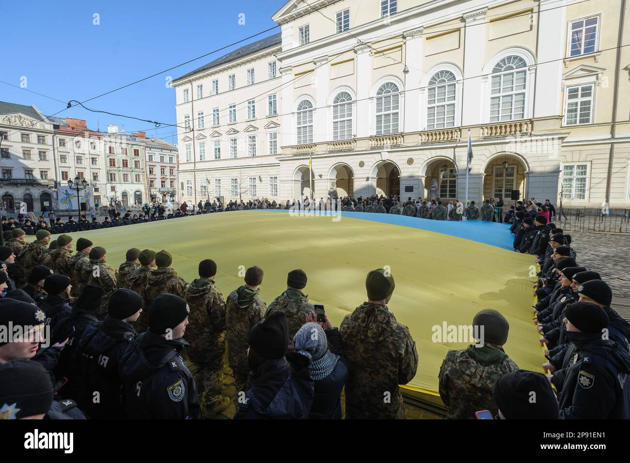 Lviv, Ukraine 10 march 2023. People sing the national anthem while ...
