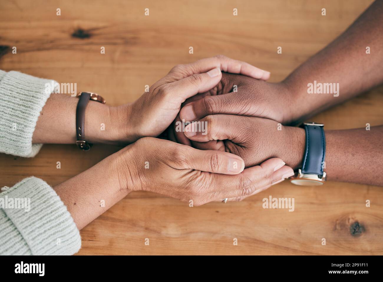 Closeup of couple holding hands for support, empathy and help with news ...