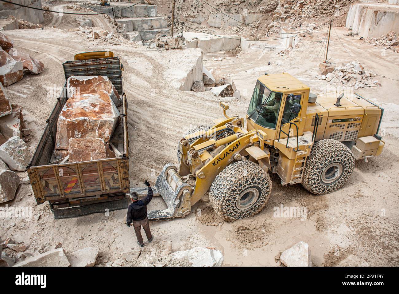 Workers guide operators during the transportation process. The quarries ...