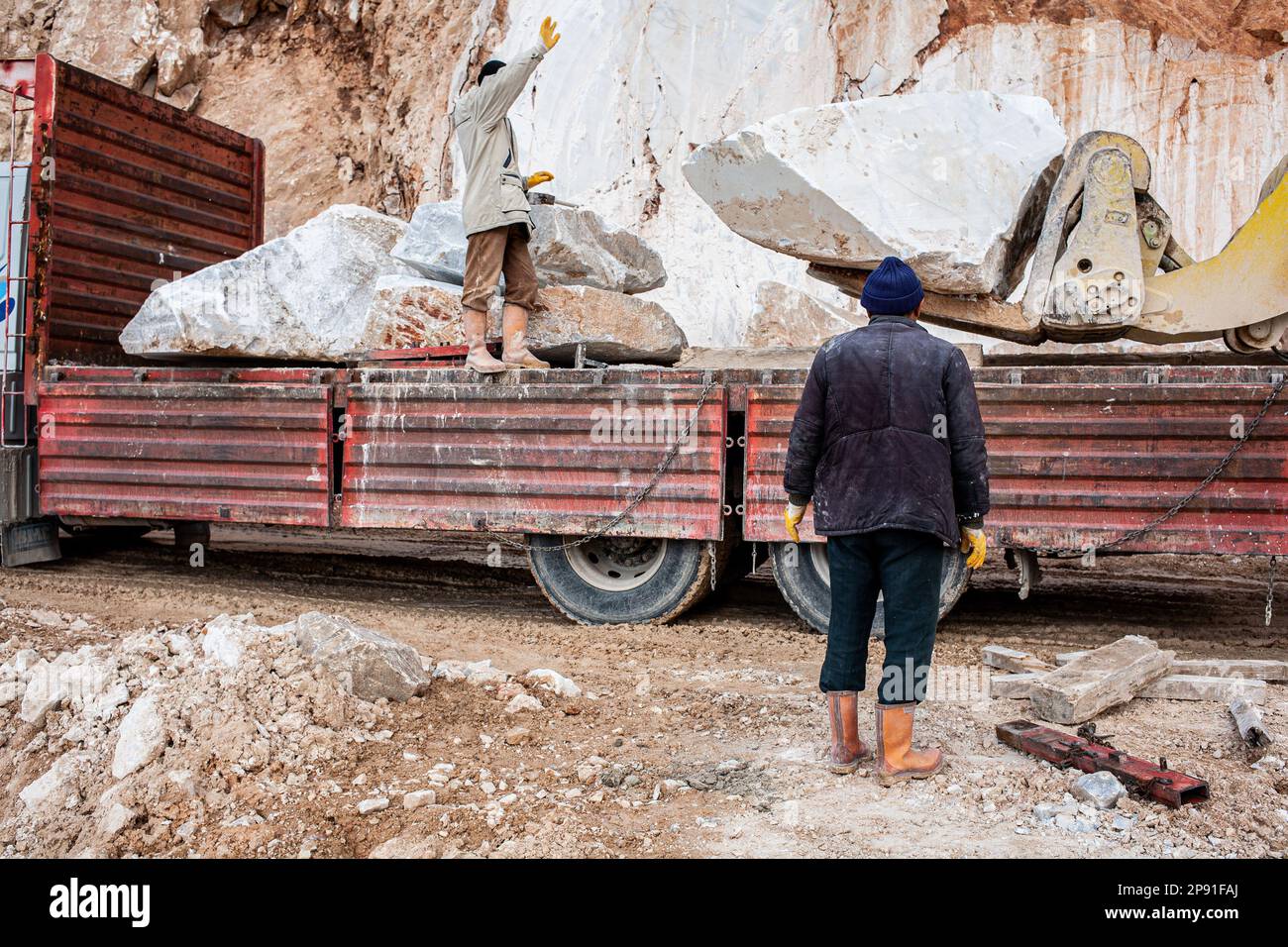 Workers guide operators during the transportation process. The quarries ...