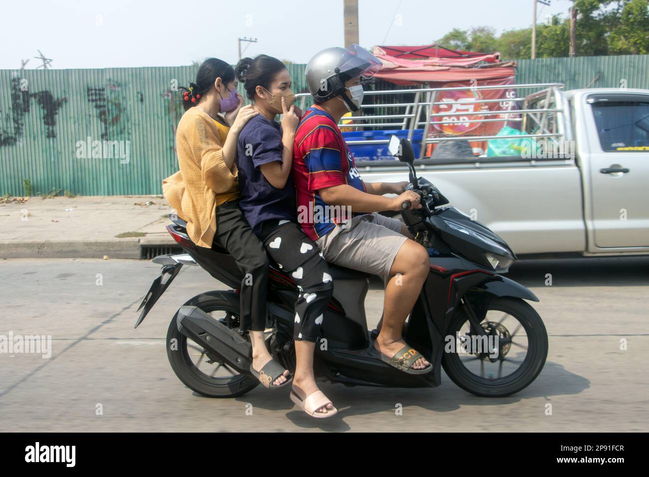 Three people on one motorbike hi-res stock photography and images - Alamy