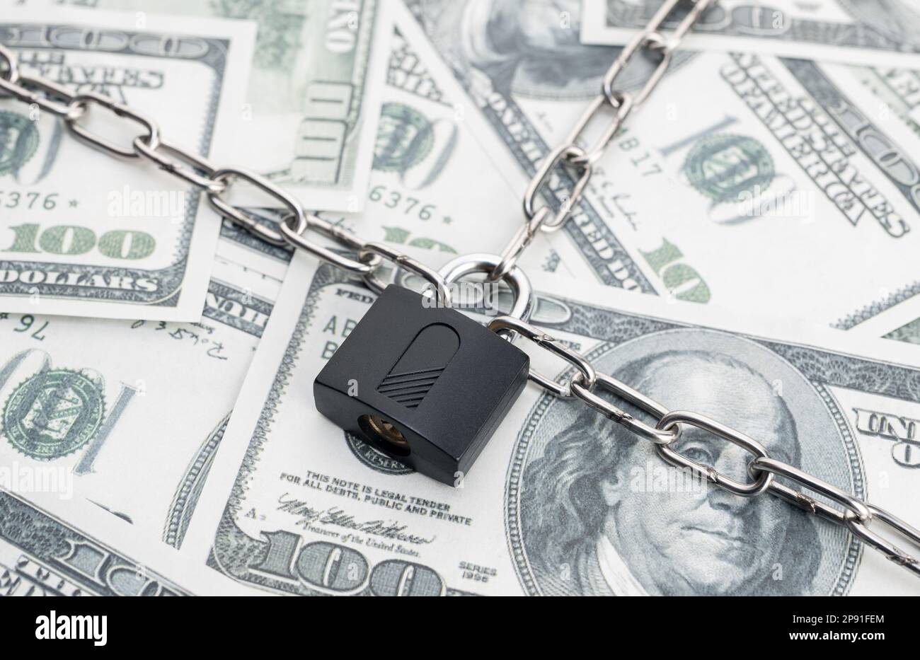 Lock security and chain on dollar banknotes background. Monetary crisis ...
