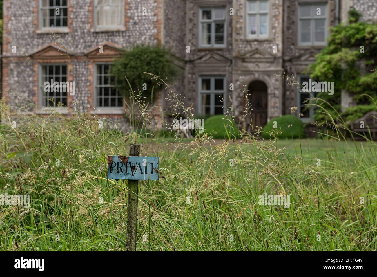 Private grounds of flint exterior of 17th century Jacobean manor house ...