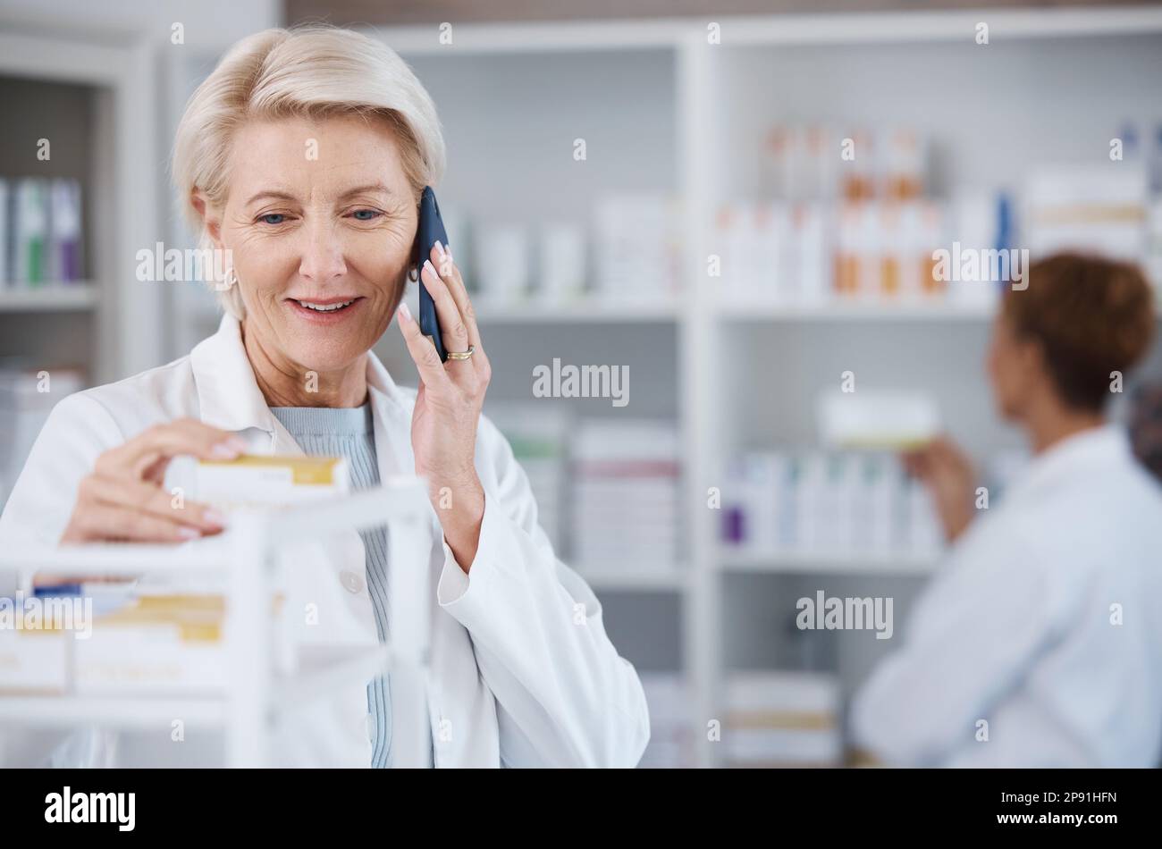 Pharmacy medicine, pharmacist phone call and woman talking in drugstore ...