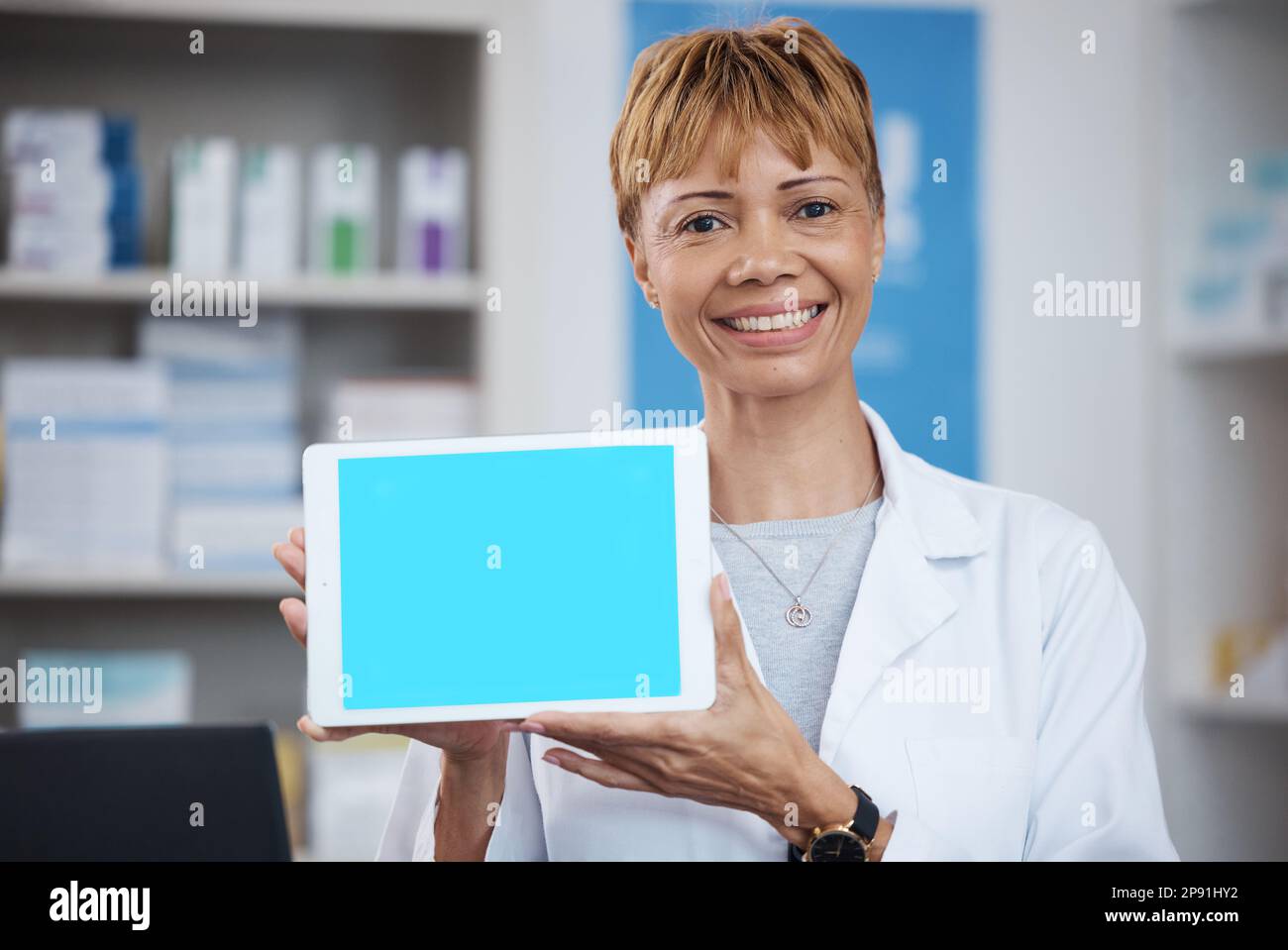 Pharmacy, pharmacist and woman with tablet green screen for advertising ...