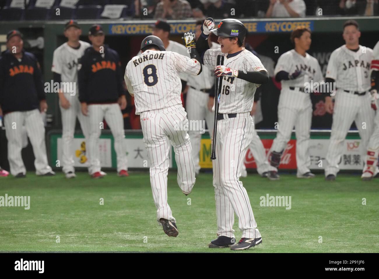 Kensuke Kondoh of Japan's celebrates with Shohei Ohtani of Japan after ...