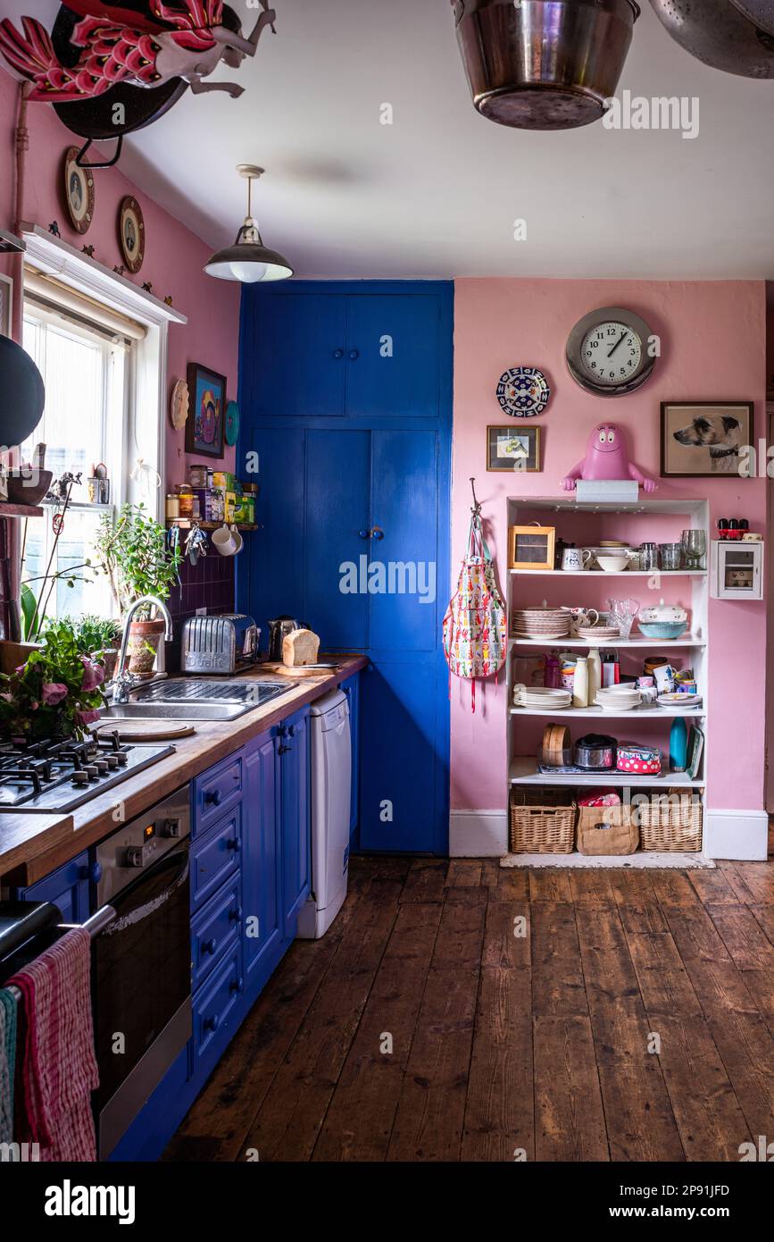PInk kitchen with contrasting cornflower blue paintwork in 16th century ...