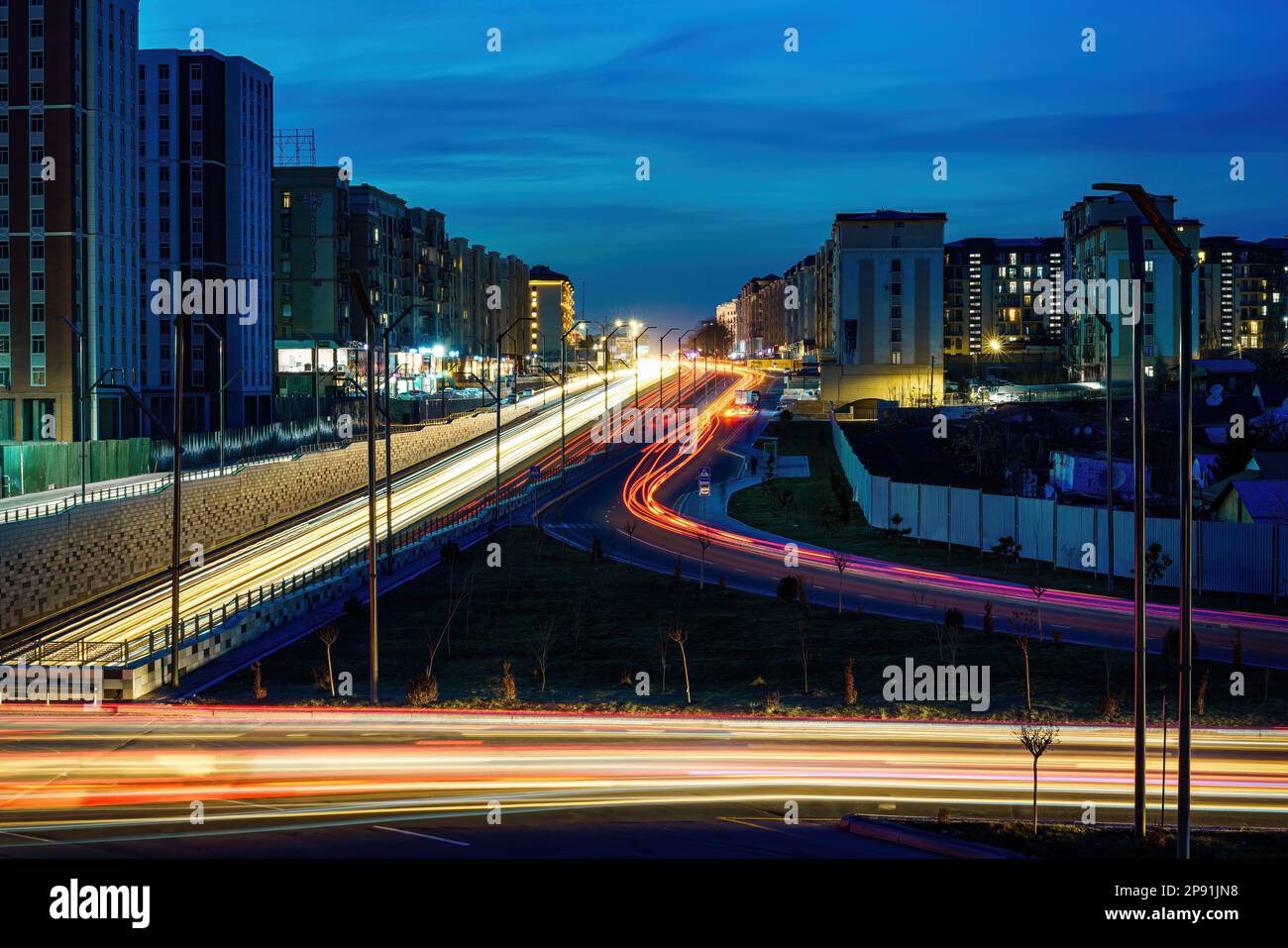 Car traffic light at night city highway Stock Photo - Alamy