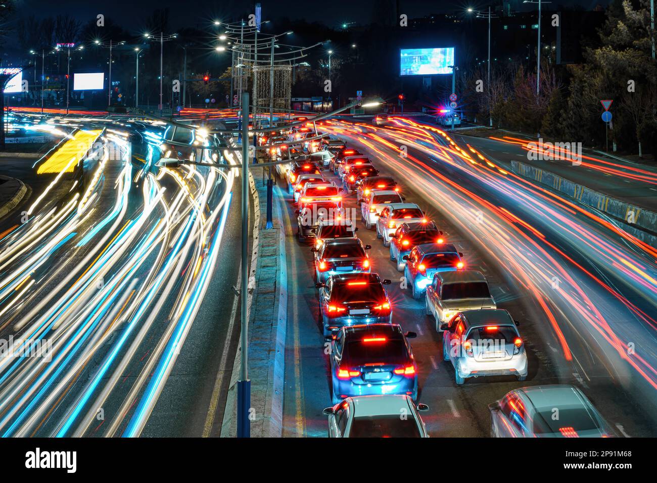 Car traffic light at night city highway Stock Photo - Alamy
