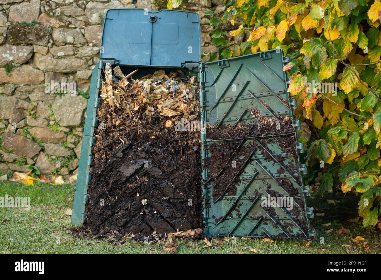 Outdoor compost bin was opened to extract mature compost formed in the ...