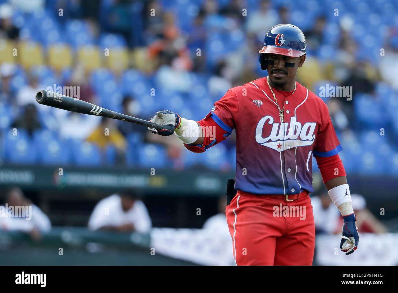 Cuba's Roel Santos gestures to his teammate during a Pool A game ...