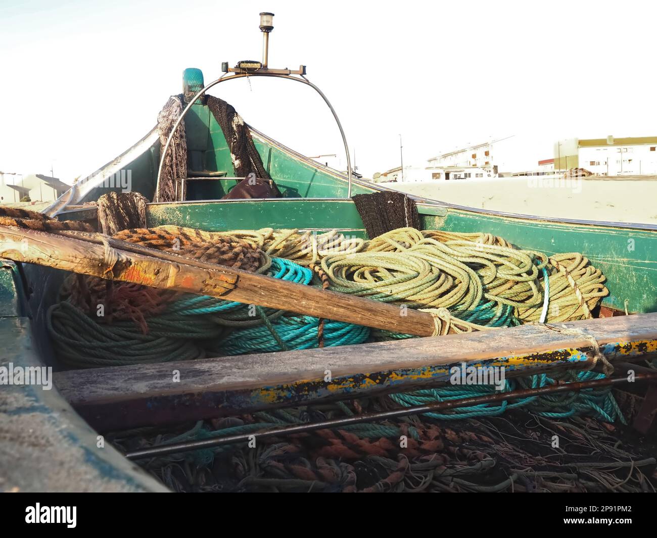 Fisher boat with nets and ropes on a beach Stock Photo - Alamy