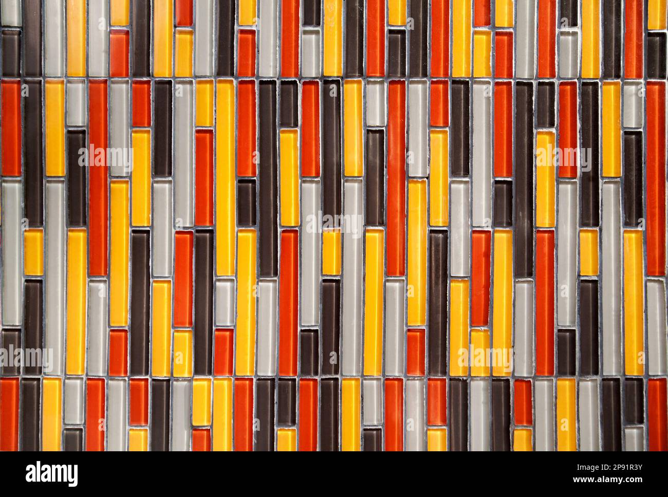 Colorful glass vertical rectangular tiled wall background: yellow, red ...