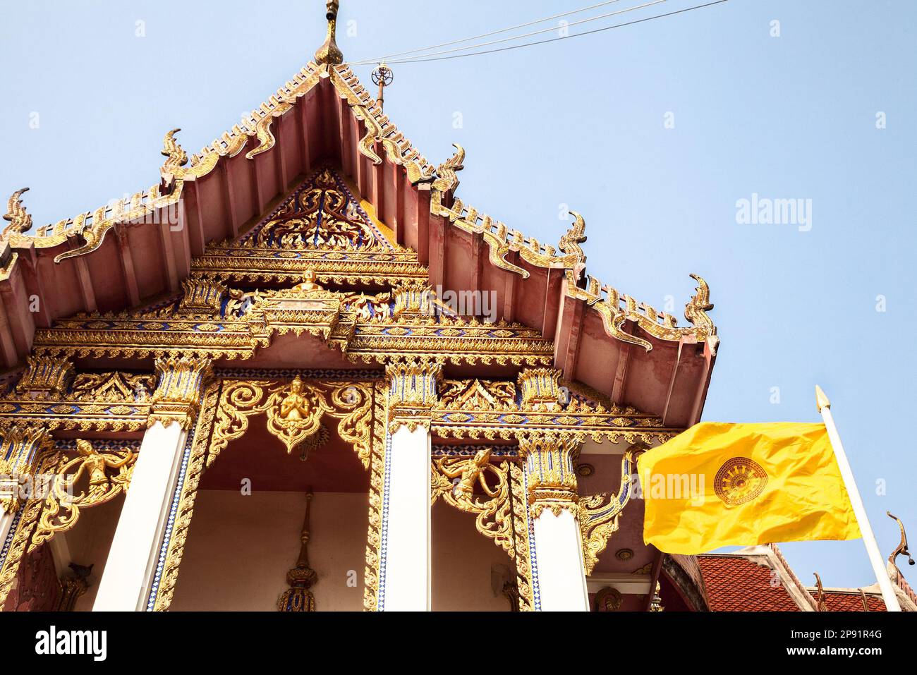 Traditional golden Thai Buddhist temple with carved ornaments and ...
