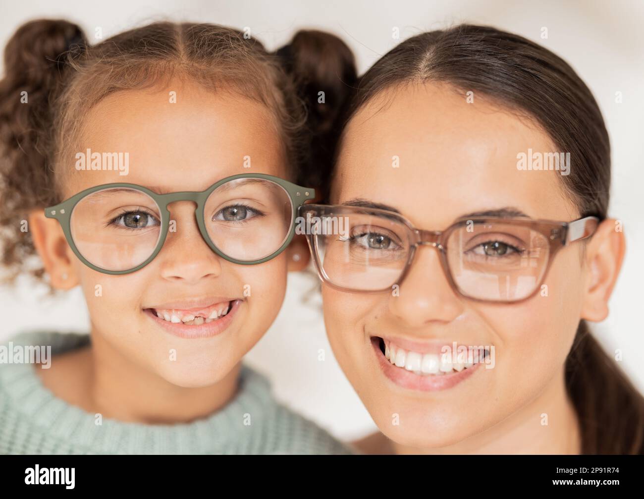 Optometrist, vision and portrait of mother and child smiling together ...