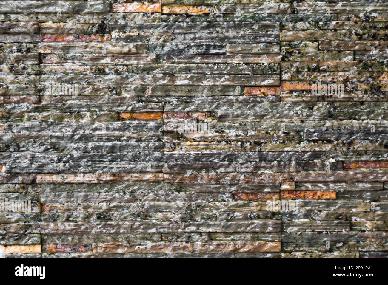 Wall waterfall with gray bricks background. Light reflections on water ...