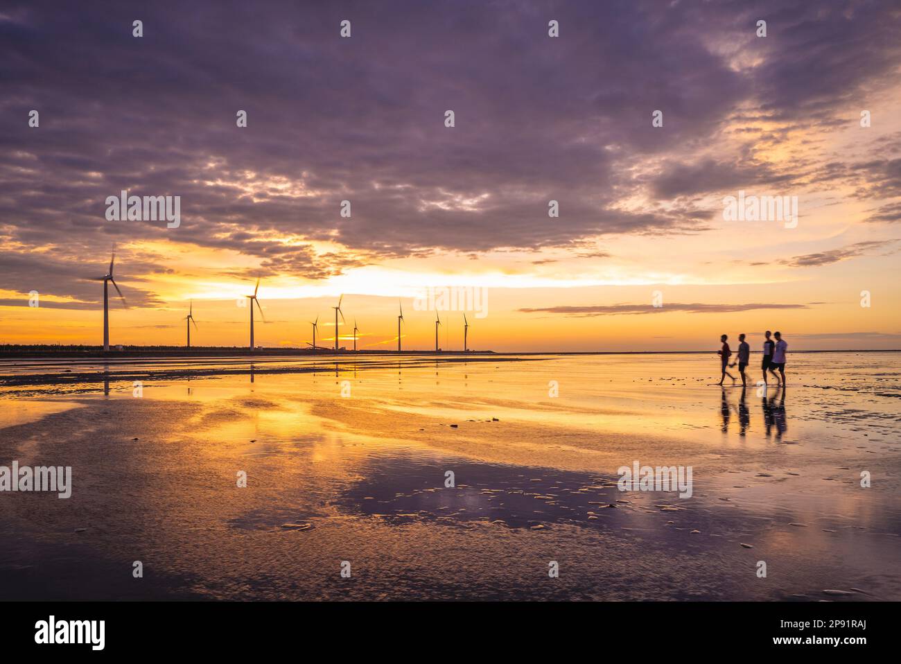 sillouette of wind turbine array at gaomei wetland, taichung, taiwan ...