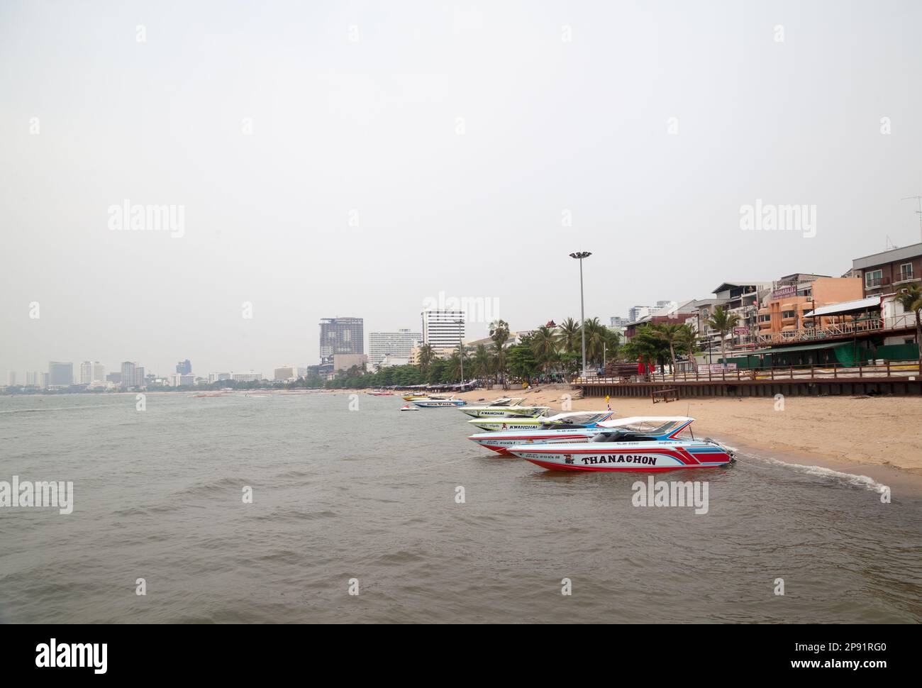 Pattaya, Thailand - March 28, 2016: Colorful boats on a beach on a ...