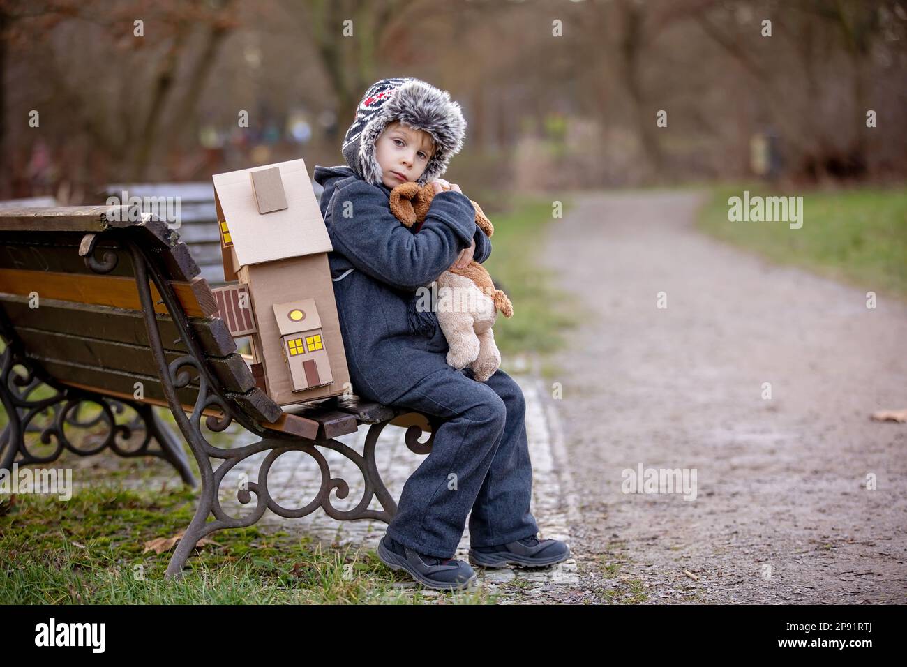 Little child, blond boy with pet dog, carying home on his back, kid ...
